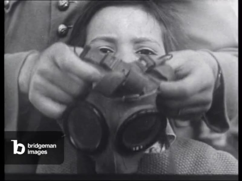 Image of Children in London being evacuated and fitted with gas masks,
