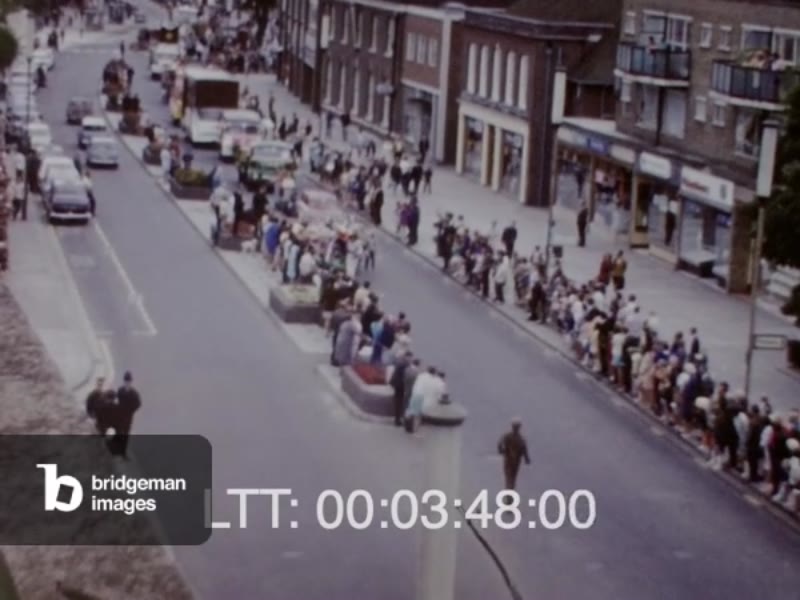 Image of Helpers prepare in hall for a parade, 1963