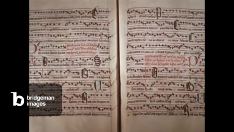 1960s: Golden reliquary statue of face and crown. Handwritten music ...