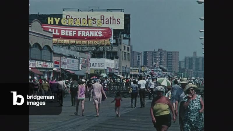 Image of Boardwalk crowded with people, Hygrade's All Beef Franks ...