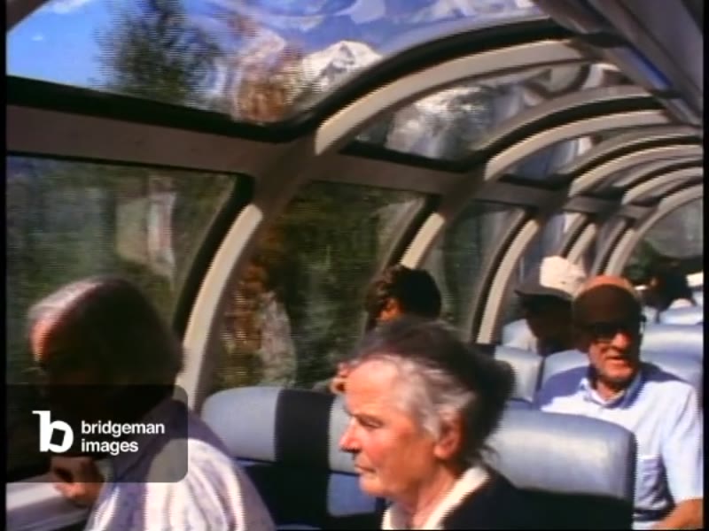 "The Canadian" train, observation dome car, people, Mt. Robson