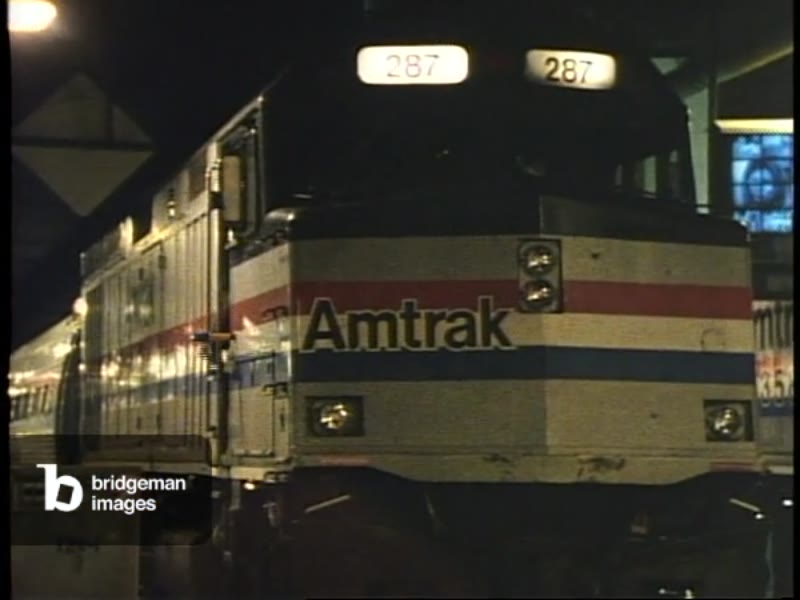 Image of The Engineer climbs into the locomotive (F40) of Amtrak's "California