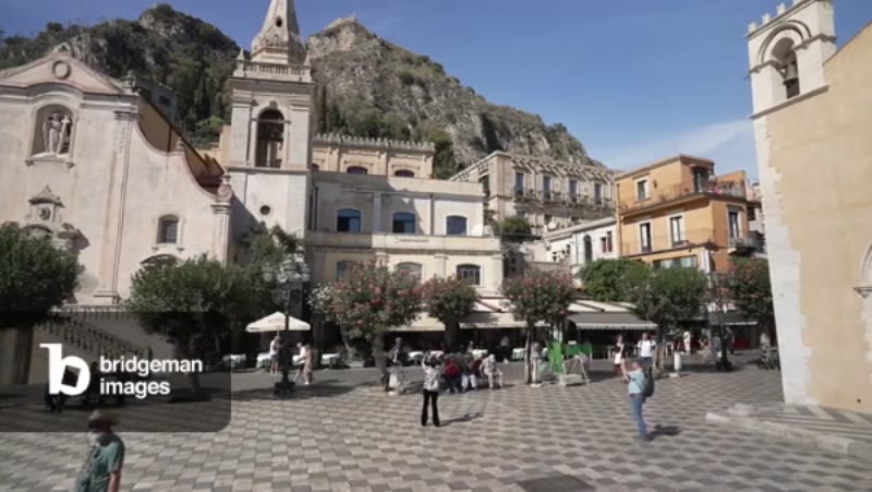 Image of Gimbal tracking shot of cafes on Corso Umberto to Chiesa