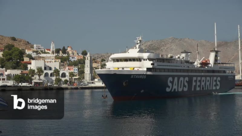 Image of Pan shot of ferry entering Symi Harbour, Symi Town, Symi