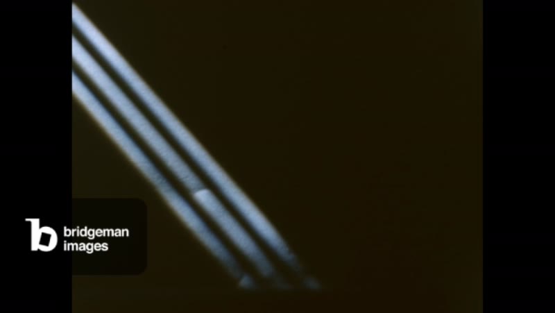 Image of 1960s: Three parallel beams of light at an angle.