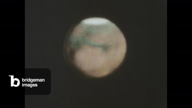 Image of 1960s: An animated diagram of Uranus in orbit. A dashed