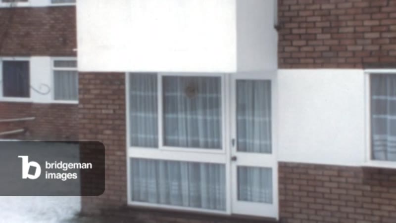 Image of Zoom in on brown brick building, 1970s