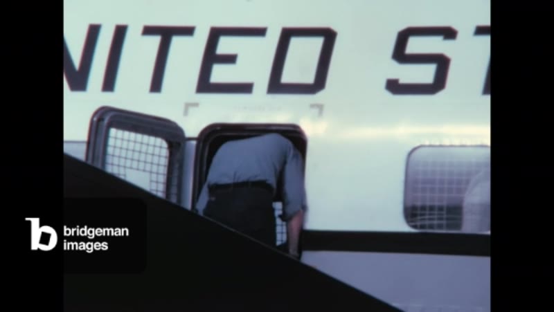 Image of Mechanics on the wing of aircraft and enter the fuselage