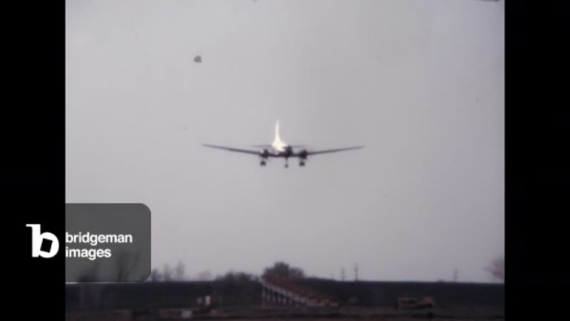 Image of Military transport aircraft landing frontal view in retro ...