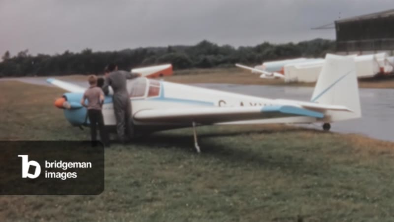 Image of Pilot teaches young student how to perform pre-takeoff checks on
