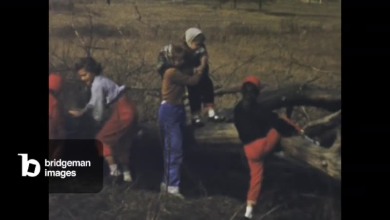 Image of United States 1965, Childhood Adventure: Kids Playing on a Log